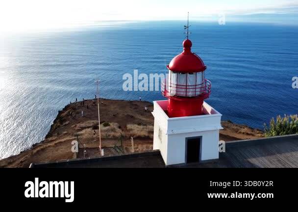 Aerial view showing the Ponta do Pargo Lighthouse perched on a cliff in ...