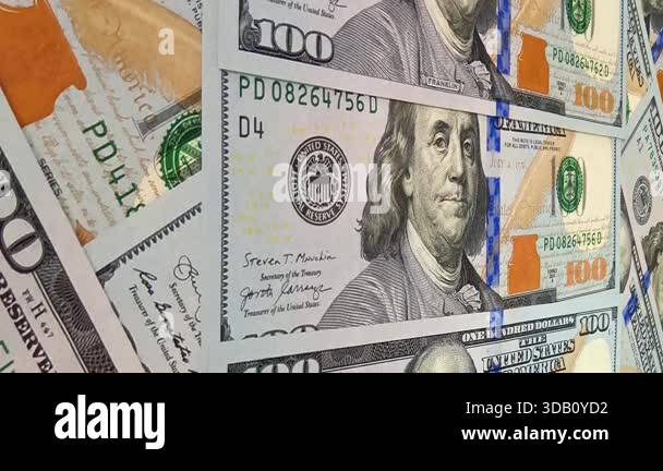 Dynamic pass above crisp 100 dollar bills forming an exclusive ...