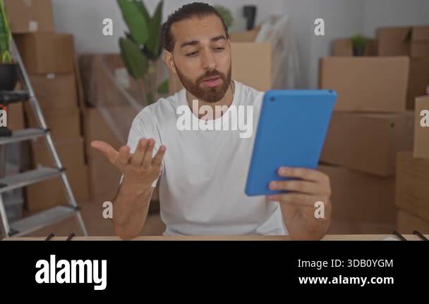 Man holding blue tablet, thumbs up and questioning open hand gesture ...