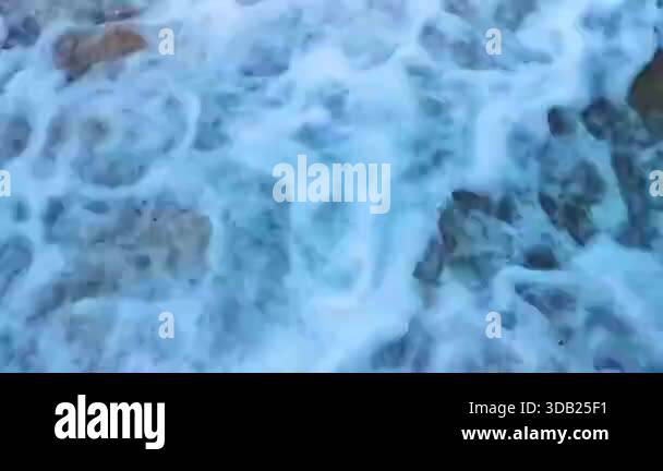 Beach sand with pebbles stones rocks colorful shells mussels and ...