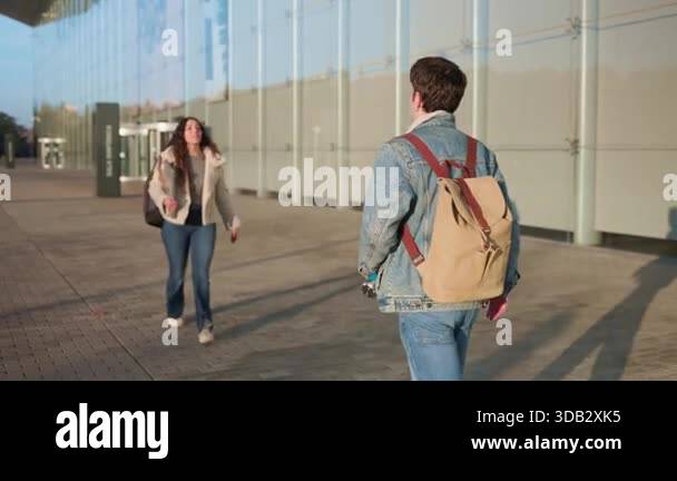 International students meeting and hugging at college campus Stock ...