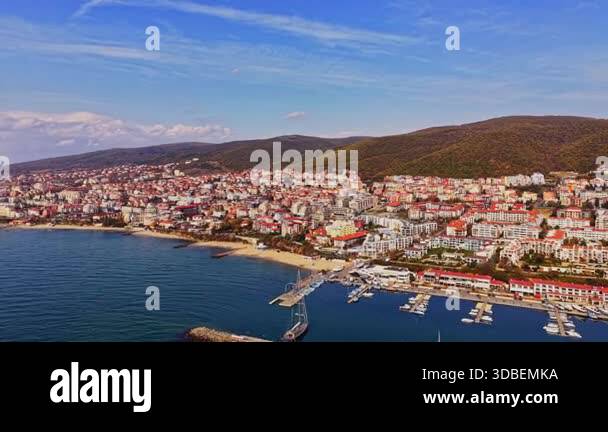 This aerial view showcases a picturesque coastal town in Bulgaria, with ...