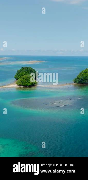 Boslon Island Beach. Turquoise ocean water with boat. Britania Group of ...