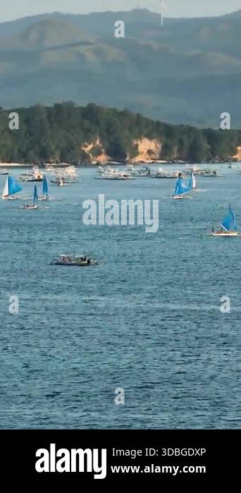 Sunset Sailing Boats and Cruise ship over the blue sea in Boracay ...