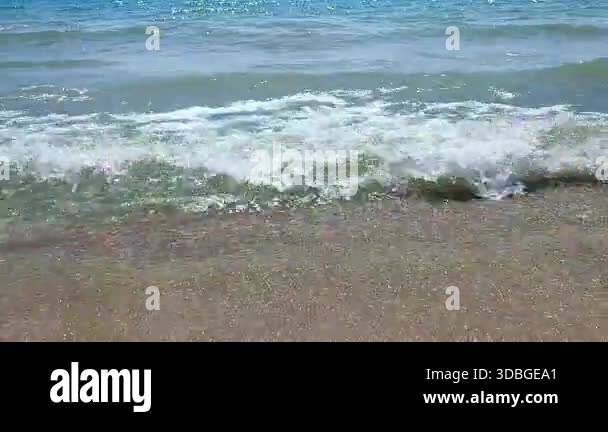 Beautiful sea waves with turquoise transparent water rolling onto sand ...