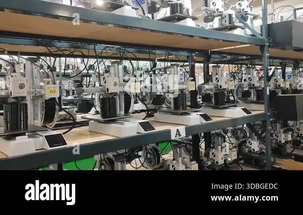 Kyiv, Ukraine, May 25, 2025: Many 3D printers printing an object. 3D ...
