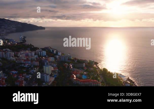 Aerial view of Funchal, Madeira shows waterfront hotels, pools, cruise ...