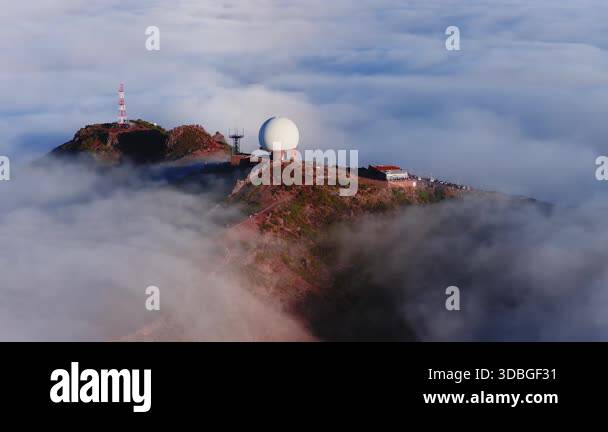 Aerial view shows Pico do Arieiro on Madeira, Portugal with white radar ...