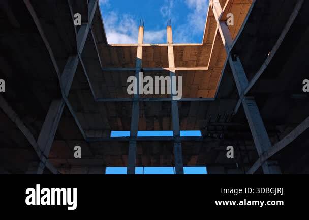 Empty space inside the building under construction. Rebars are on the ...