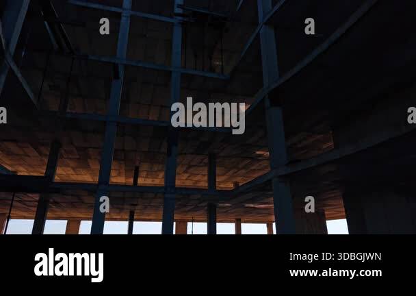 Going up inside the space in the center of multi-storied building. View on the floors of the ...