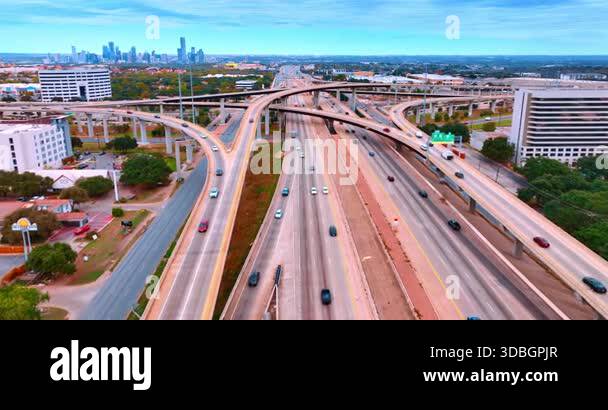Modern city freeway with many cars. Busy auto express way at daytime ...