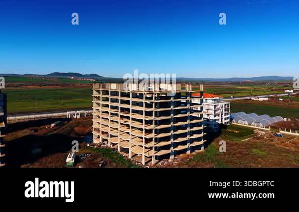 Flying away from the multi-storied structure at the construction site ...