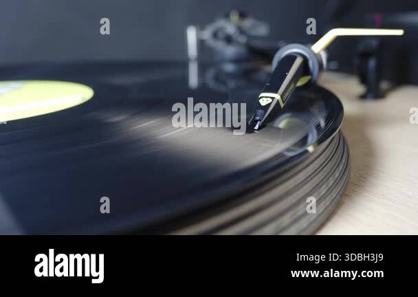 Spinning Vinyl Record with RGB Party Lighting; Extreme close-up of a ...