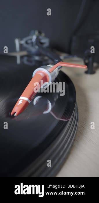 Spinning Vinyl Record on Turntable Cartridge; Close-up, vertical shot ...