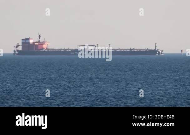 Cargo ship moving steadily across the ocean Stock Video Footage - Alamy