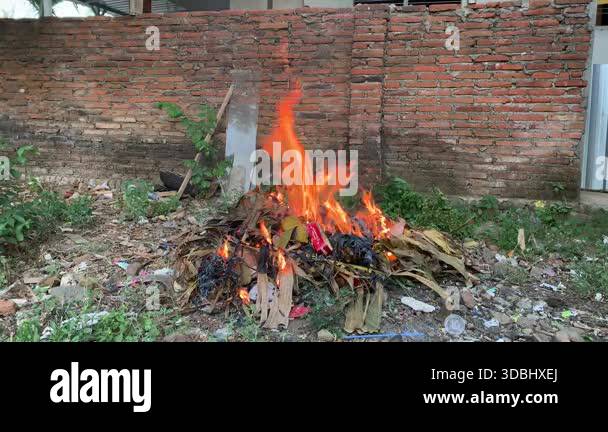 Close Up of Bright Flames Burning Household Trash Pile Outdoors, Heavy ...