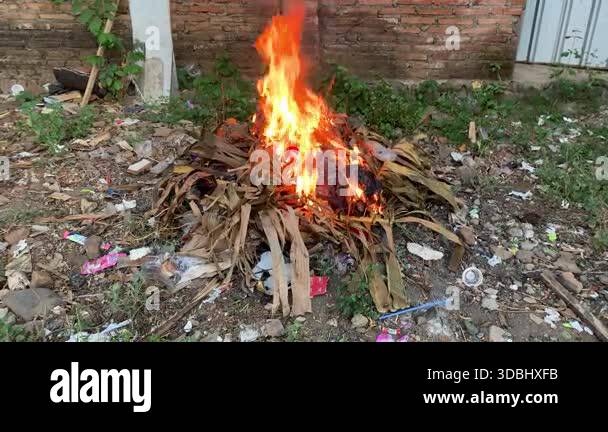 Close Up of Bright Flames Burning Household Trash Pile Outdoors, Heavy ...