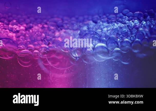 Fluorescent oil fluid. Gel bubbles. Defocused blue purple color ...
