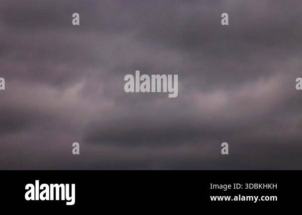 The dark clouds that rush forward to right side quickly before the ...