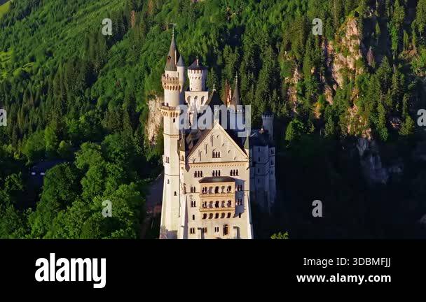 Neuschwanstein castle perching dramatically on rocky cliff, ivory ...