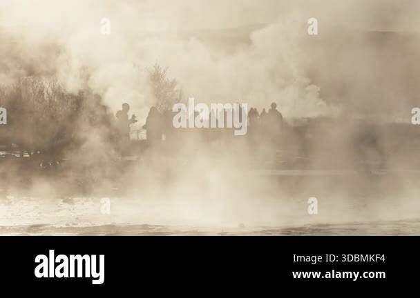 People walking through smoke, silhouettes of people in the polluted ...