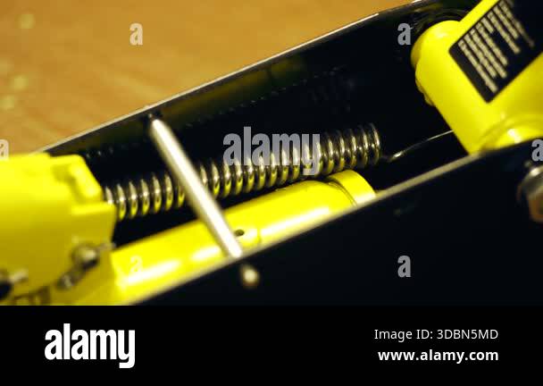 Compressing jack spring during hydraulic mechanism movement. Tensioning ...
