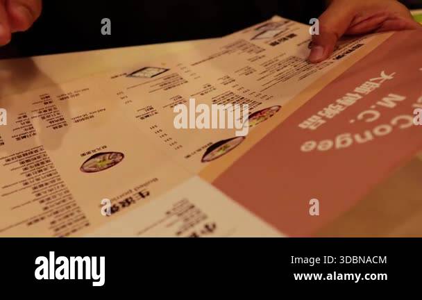 Hands pointing at a restaurant menu in Hong Kong Stock Video Footage ...