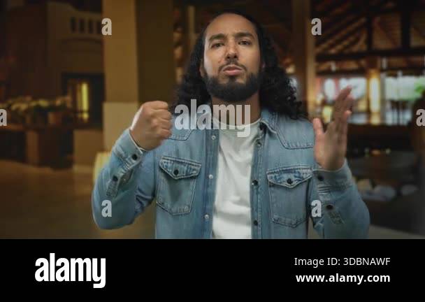 Man clapping hands in building restaurant interior with denim jacket ...