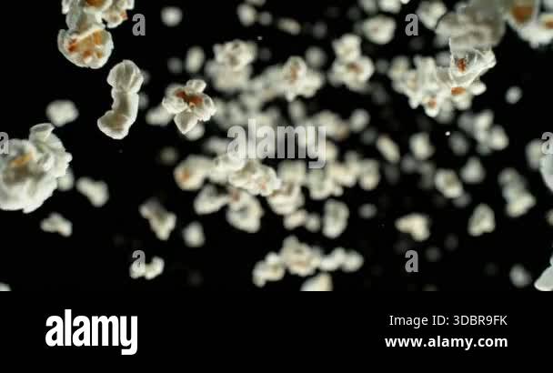 Super Slow Motion of Falling Popcorn, Wide Angle Shot. Isolated on ...