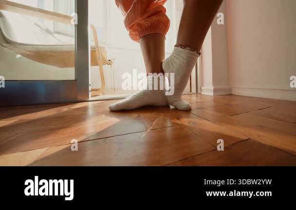 white dancer toe point and weight shift on wooden floor, delicate ...