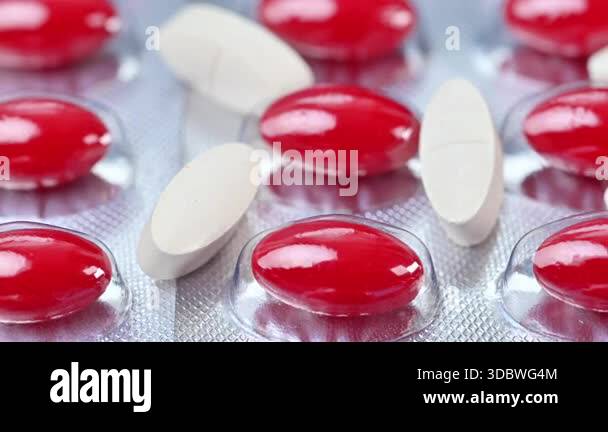 A close-up video of red vitamin capsules Stock Video Footage - Alamy