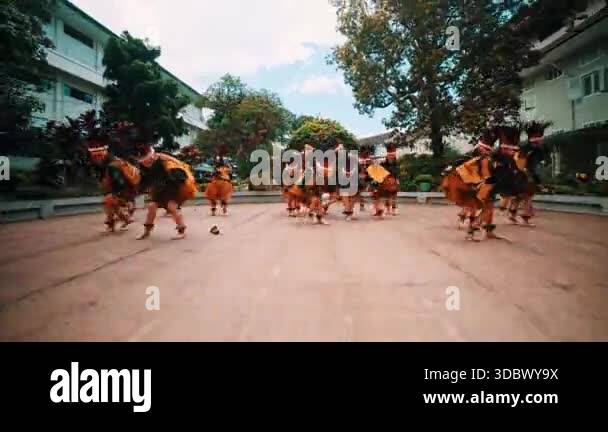 A wide shot of a female dance troupe performing a synchronized routine ...