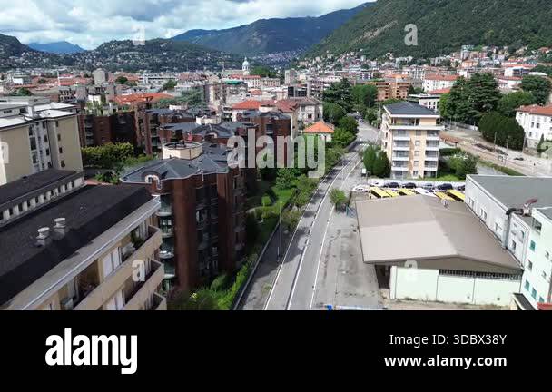 aerial drone view of historic palaces in Como city center with the blue ...