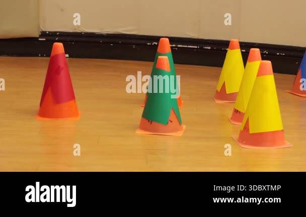 Brightly colored cones create a playful obstacle course in a lively ...