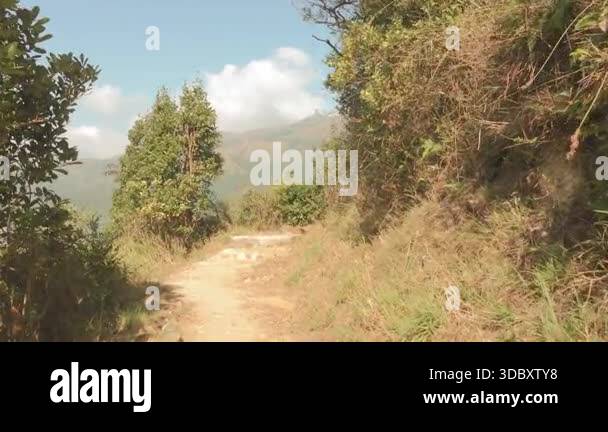 Exploring a scenic mountain trail with stunning views of the distant ...