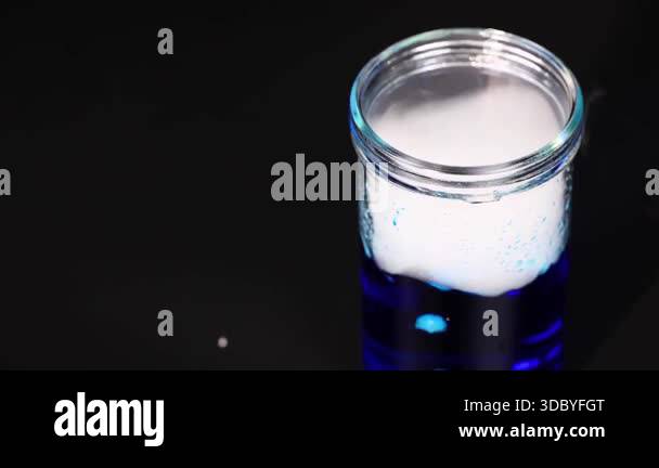 Chemical reaction between dry ice and water Stock Video Footage - Alamy