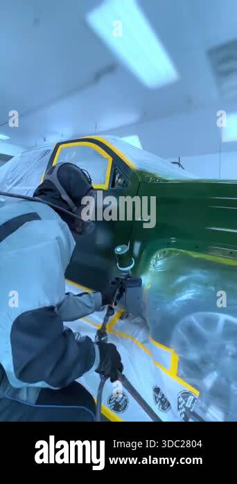 Gloved Technician Sprays Green Car Bumper Under Fluorescent Lights ...