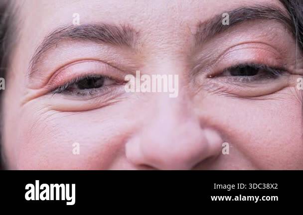 Close-Up Of Dark Feminine Eyes With Light Makeup And Subtle Smile ...