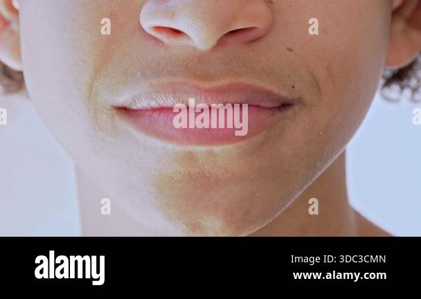 Tight Frame On Lower Face Of Young Individual Smiling Slightly With ...