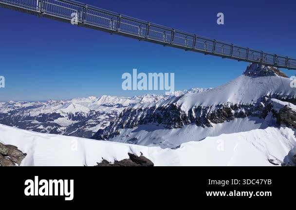 People Walking Across the Suspension Bridge on Glacier 3000 with Cable ...