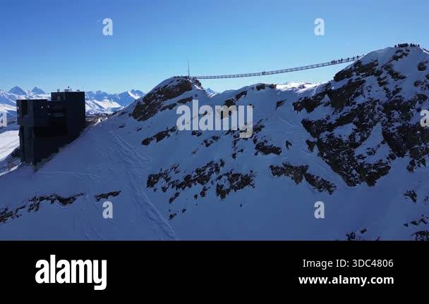 People Walking Across the Suspension Bridge on Glacier 3000 with Cable ...