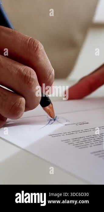 Vertical HD close up video of businessman hands signing a business ...
