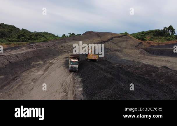 Excavator Loading Dump Truck in Open-Pit Mining Operation Stock Video ...