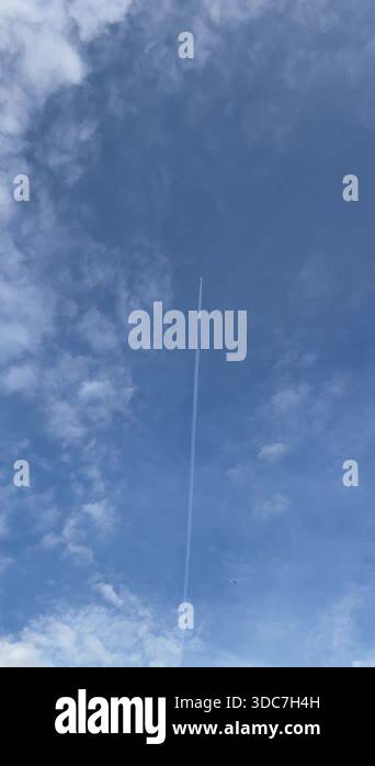 High Altitude Contrail in Blue Sky. Long, white vapor trail (contrail ...