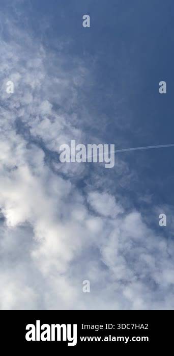 High Altitude Contrail in Blue Sky. Long, white vapor trail (contrail ...