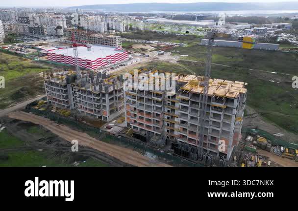 Aerial view of a large construction site with two multi-storey ...