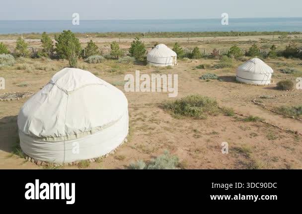 Aerial view of nomadic yurt camp. Yurts by the Shores of Issyk-Kul Lake ...