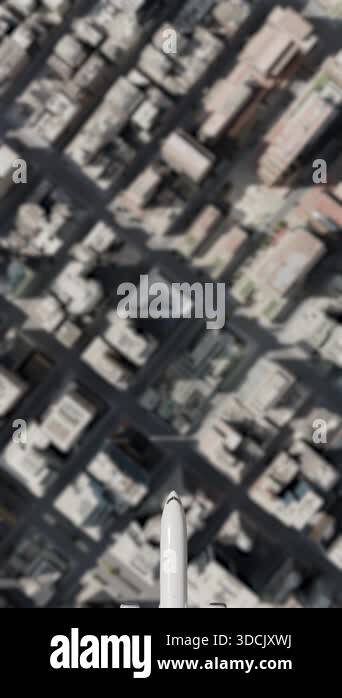 Above an Airplane Flying Over High-Rise Buildings in a Modern City ...