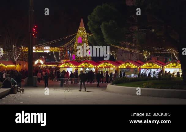 Madrid, Spain, Christmas, 12-14-2025: Crowd walking past festive stalls ...
