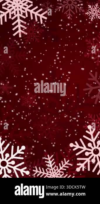 Pink and red snowflakes on deep red background with falling white ...